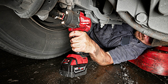 man using a Milwaukee tool